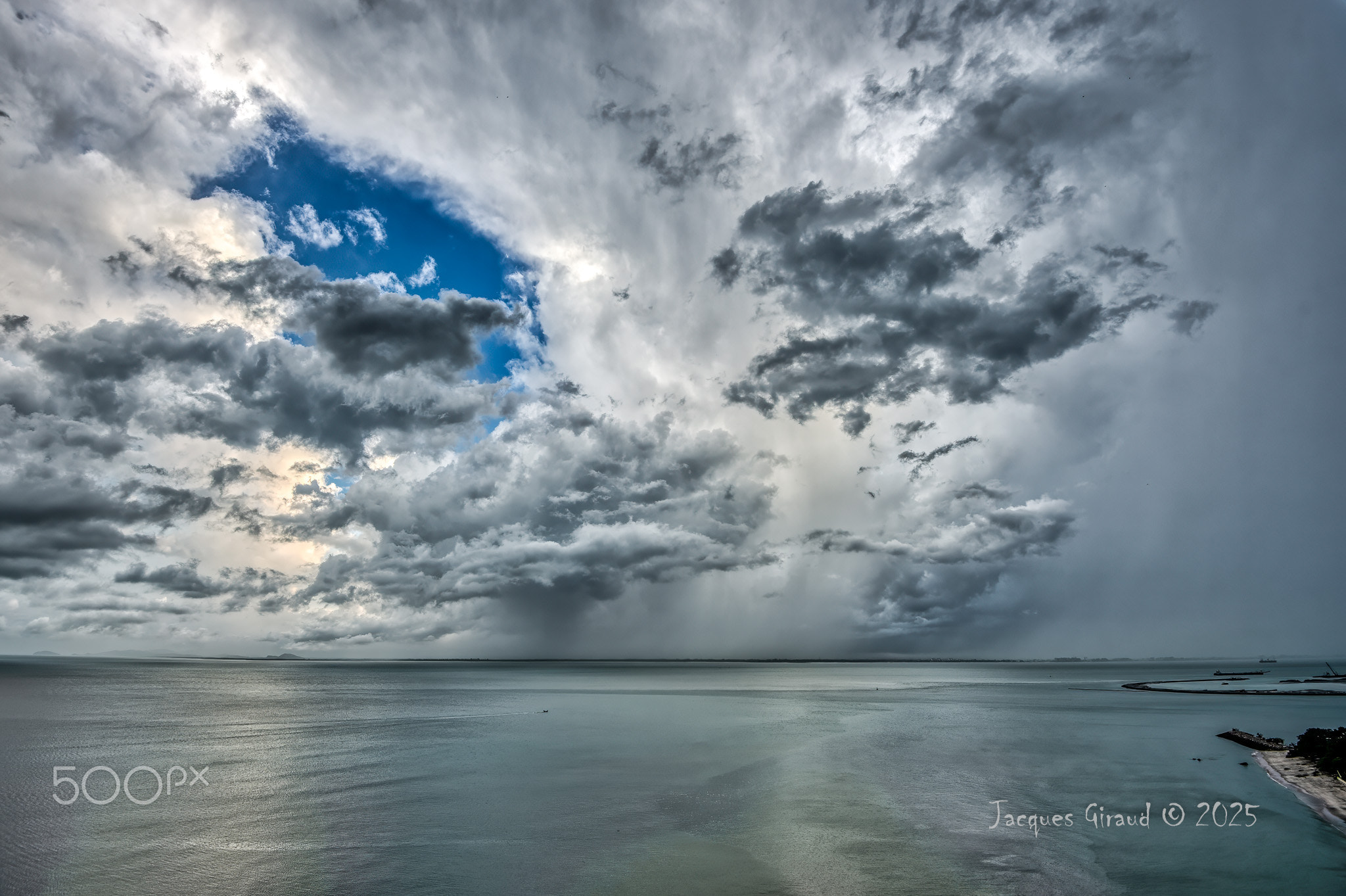 Dramatic Clouds Loom Over Water Reflecting Nature's Power | nature ...