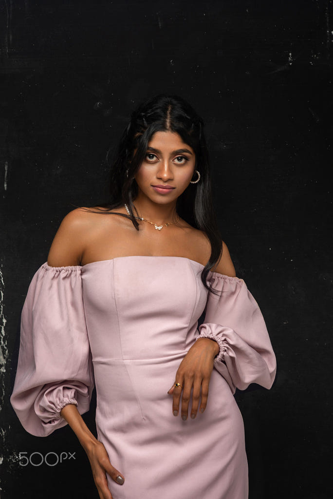 Elegant Woman Poses in Pink Dress, Exuding Sophistication and Grace ...