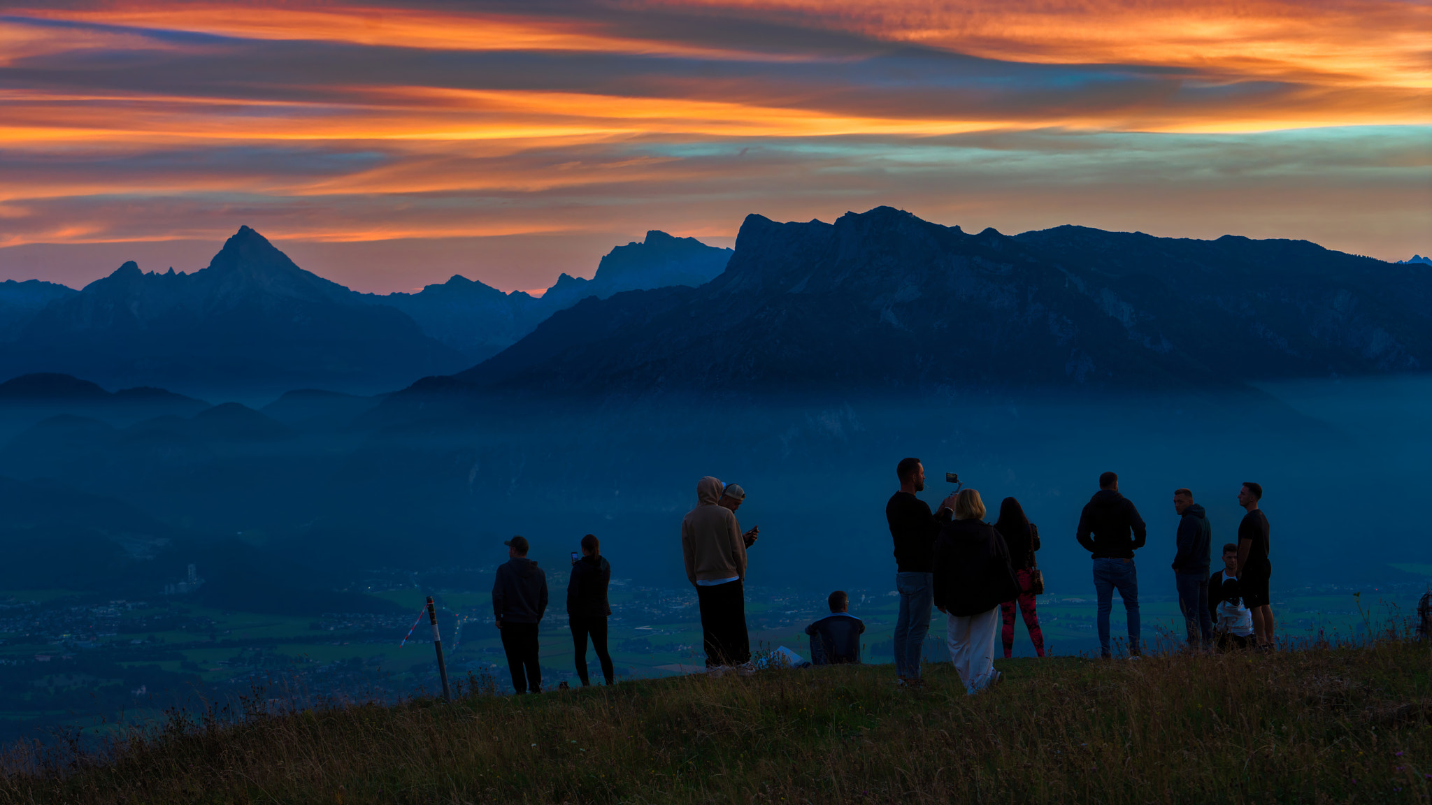 Silhouettes Against Mountain Sunset Symbolizing Shared Experience and ...