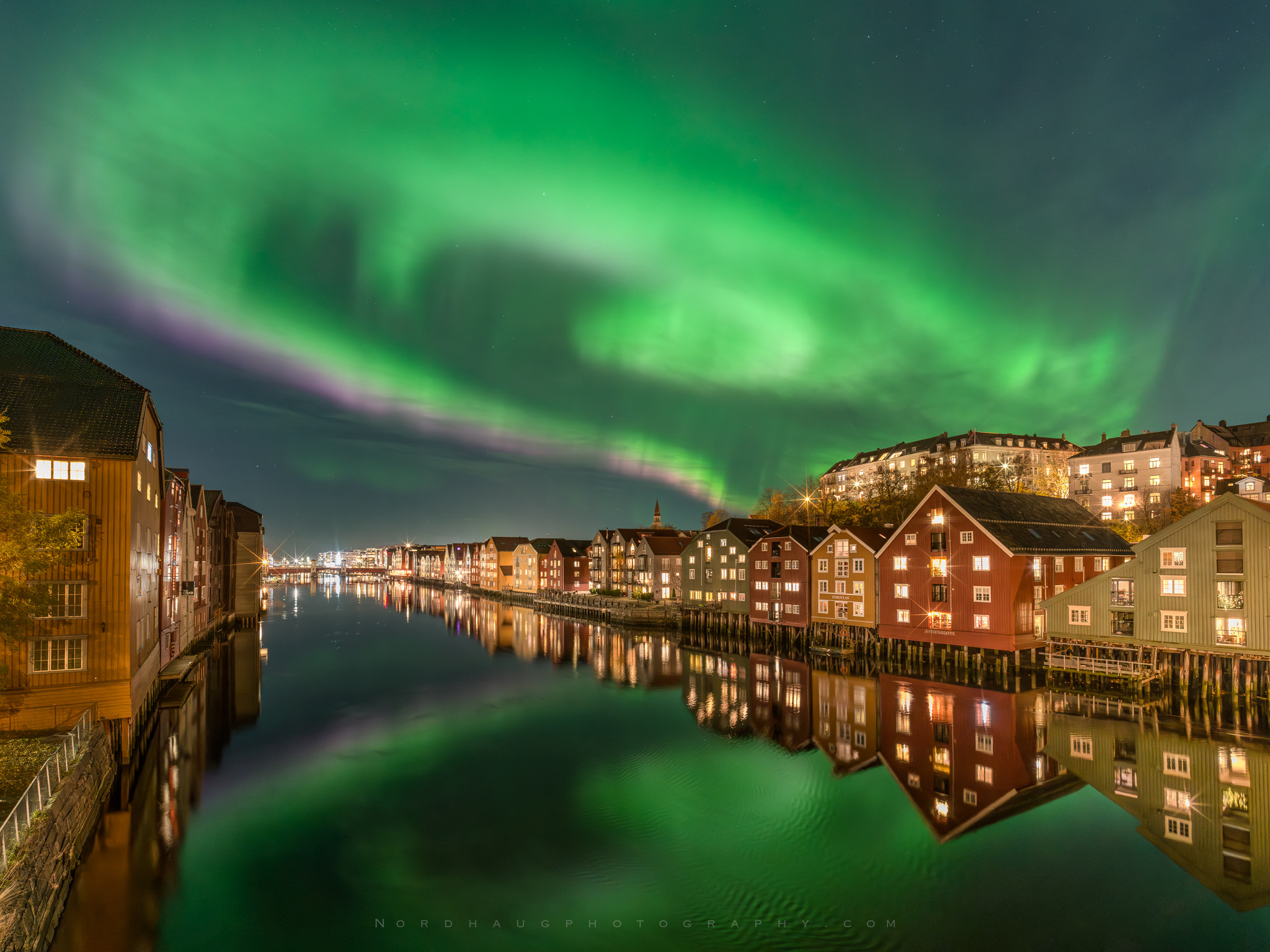 Aurora Borealis Over Waterfront Village Revealing Cosmic Spectacle and ...