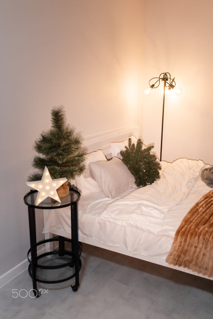 Cozy Bedroom Setting with Warm Lighting Suggesting Comfort and Peaceful ...