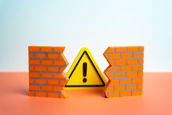 Broken Wall with Warning Sign Symbolizing Obstacle and Risk | creative ...