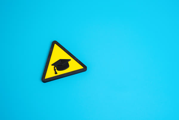 Graduation Cap Warning Sign Representing Educational Challenges ...