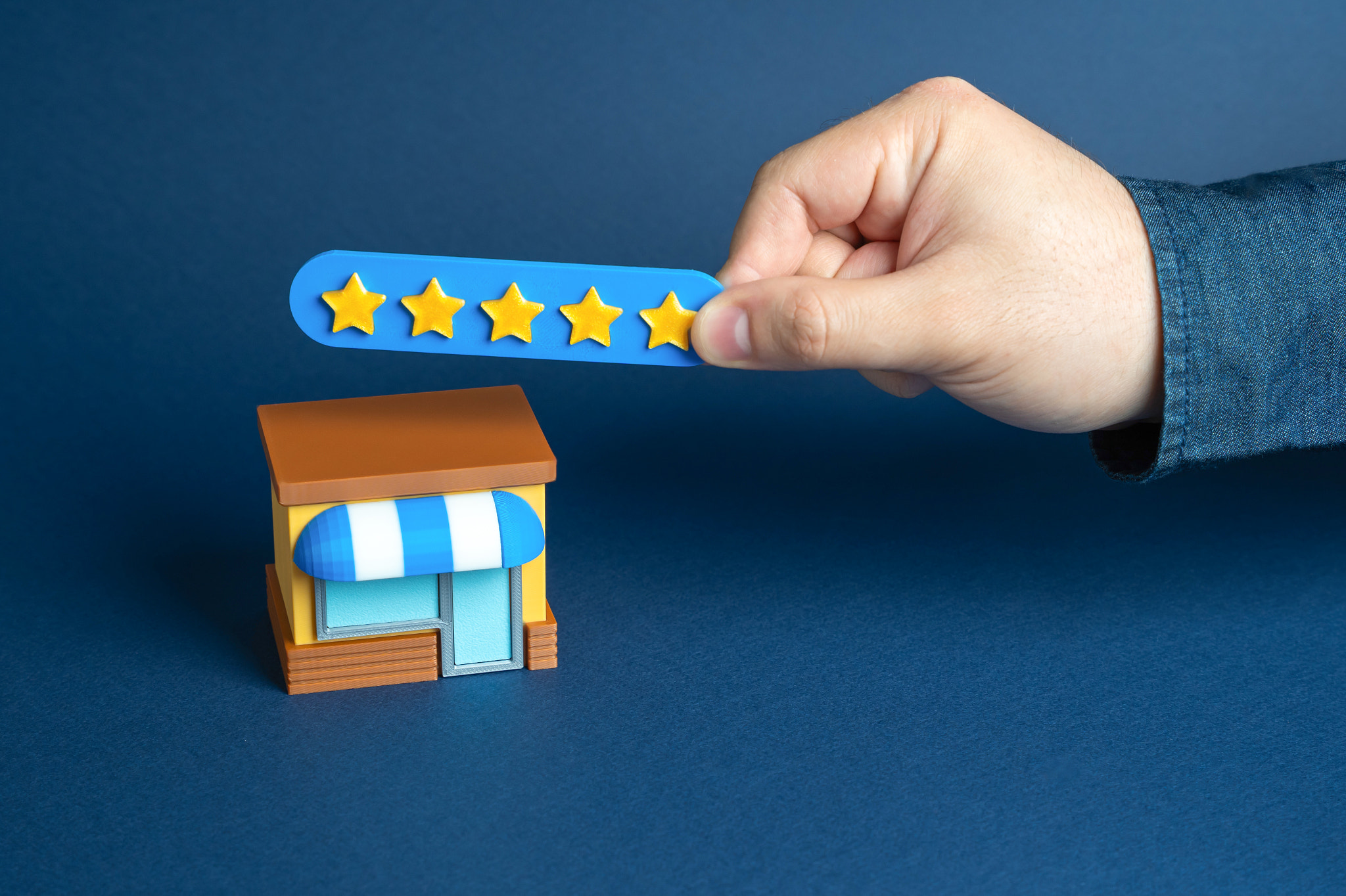 Rating Stars Over Storefront Symbolizing Customer Satisfaction | still ...