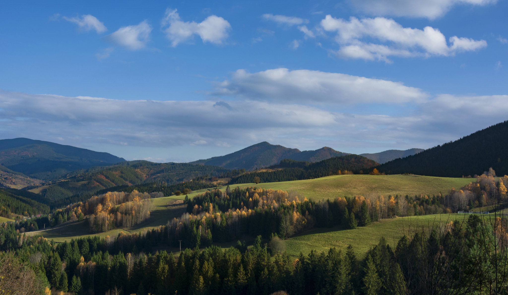 Rolling Hills Under Blue Sky Showcasing Natural Beauty and Vastness ...