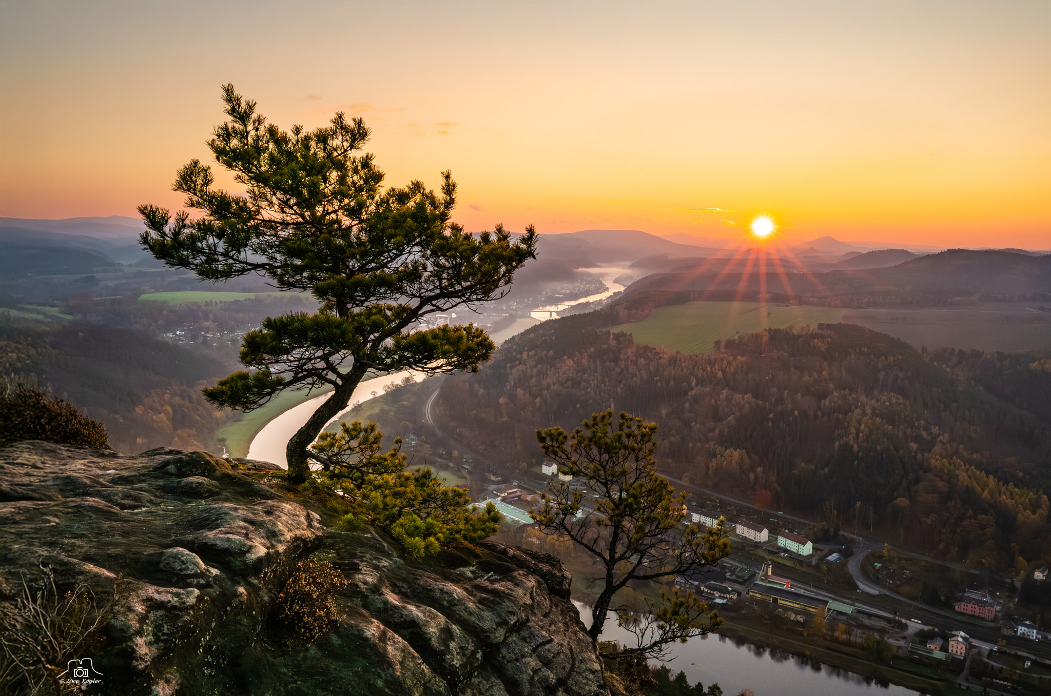 Solitary Tree Overlooking River at Sunset Evoking Serenity and ...