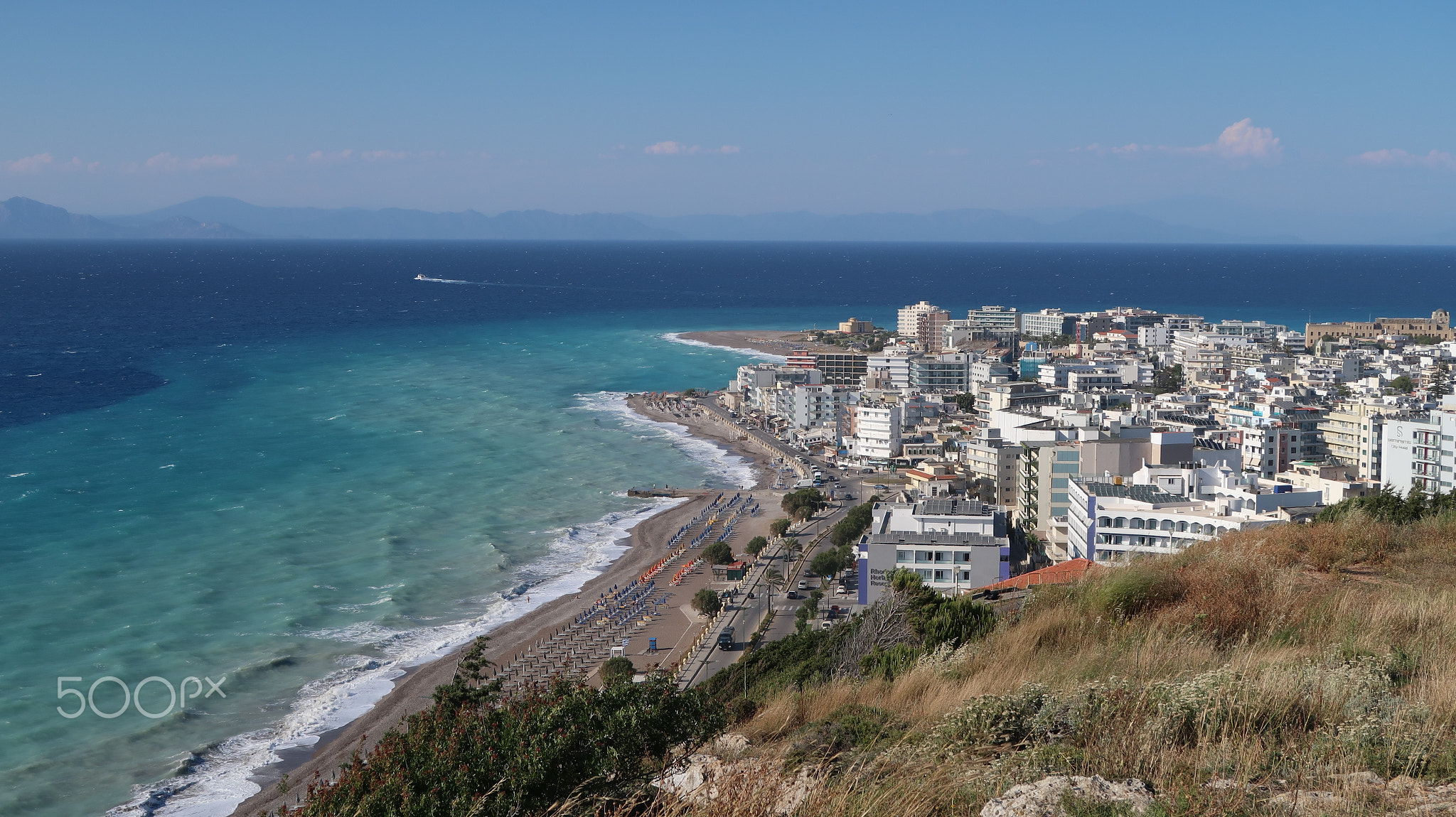 Coastal Town Embraces the Azure Sea Under a Clear Sky | landscape photo ...