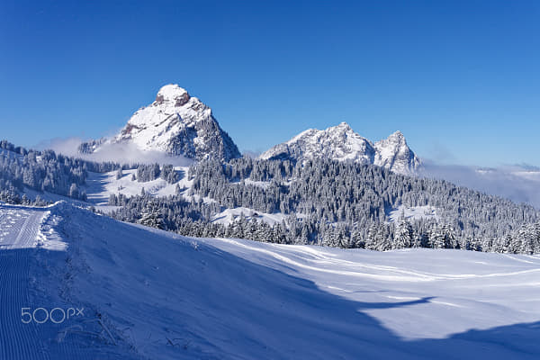Snowy Mountains Under a Clear Sky Evoking Grandeur and Serenity ...