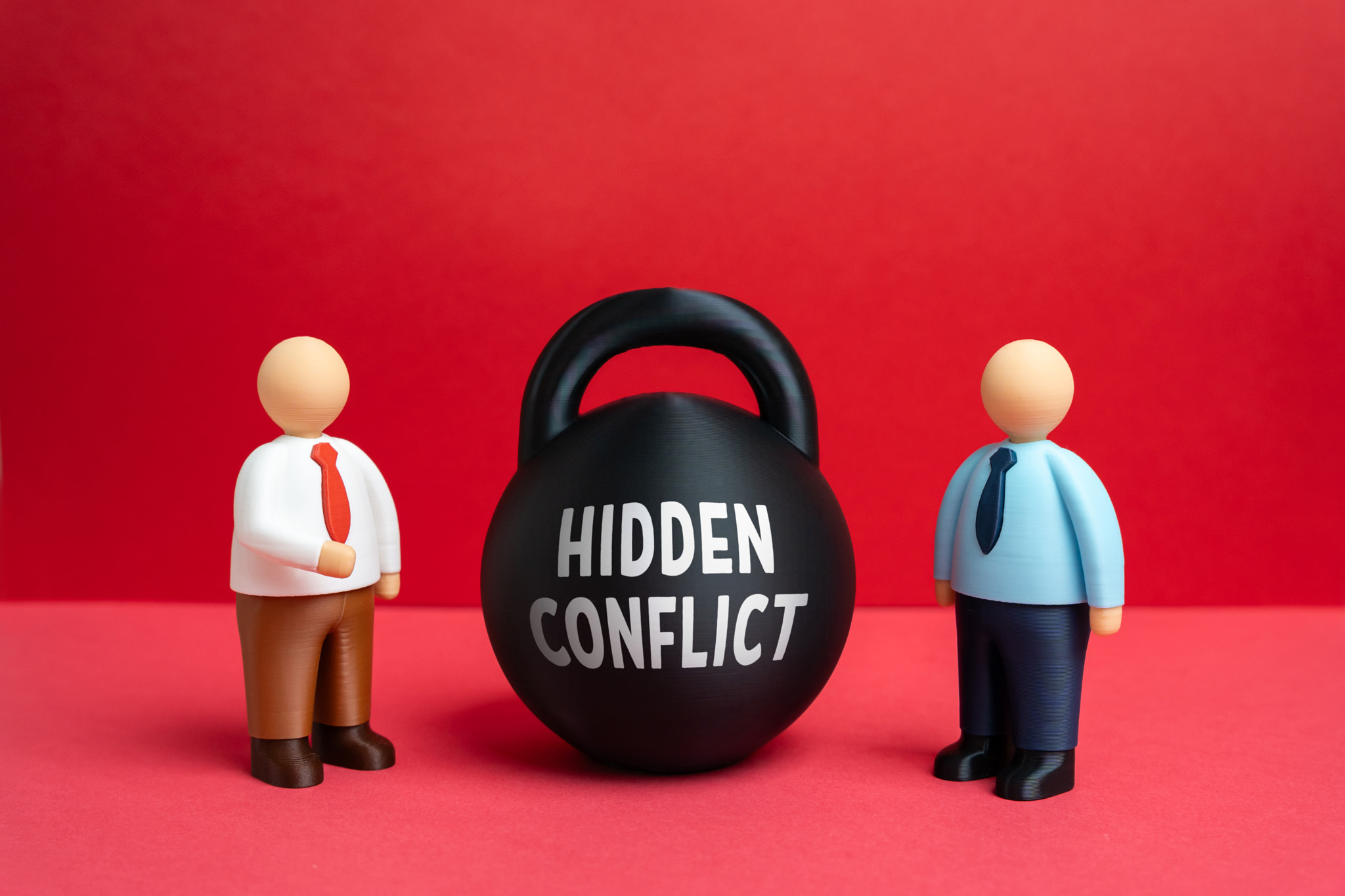 Two Figures Divided by a Weight Representing Hidden Conflict and ...