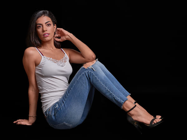 Confident Woman Poses in Display of Self-Assurance | people photo by ...
