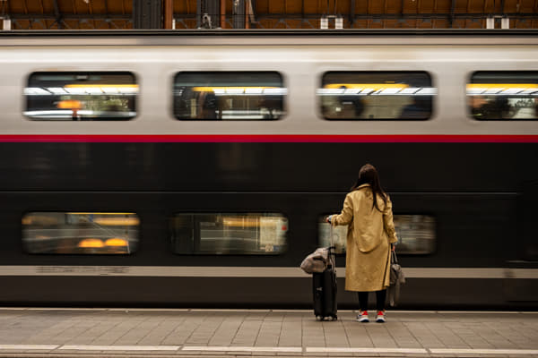 Traveler Awaiting Train Symbolizing Journey and Anticipation | city ...
