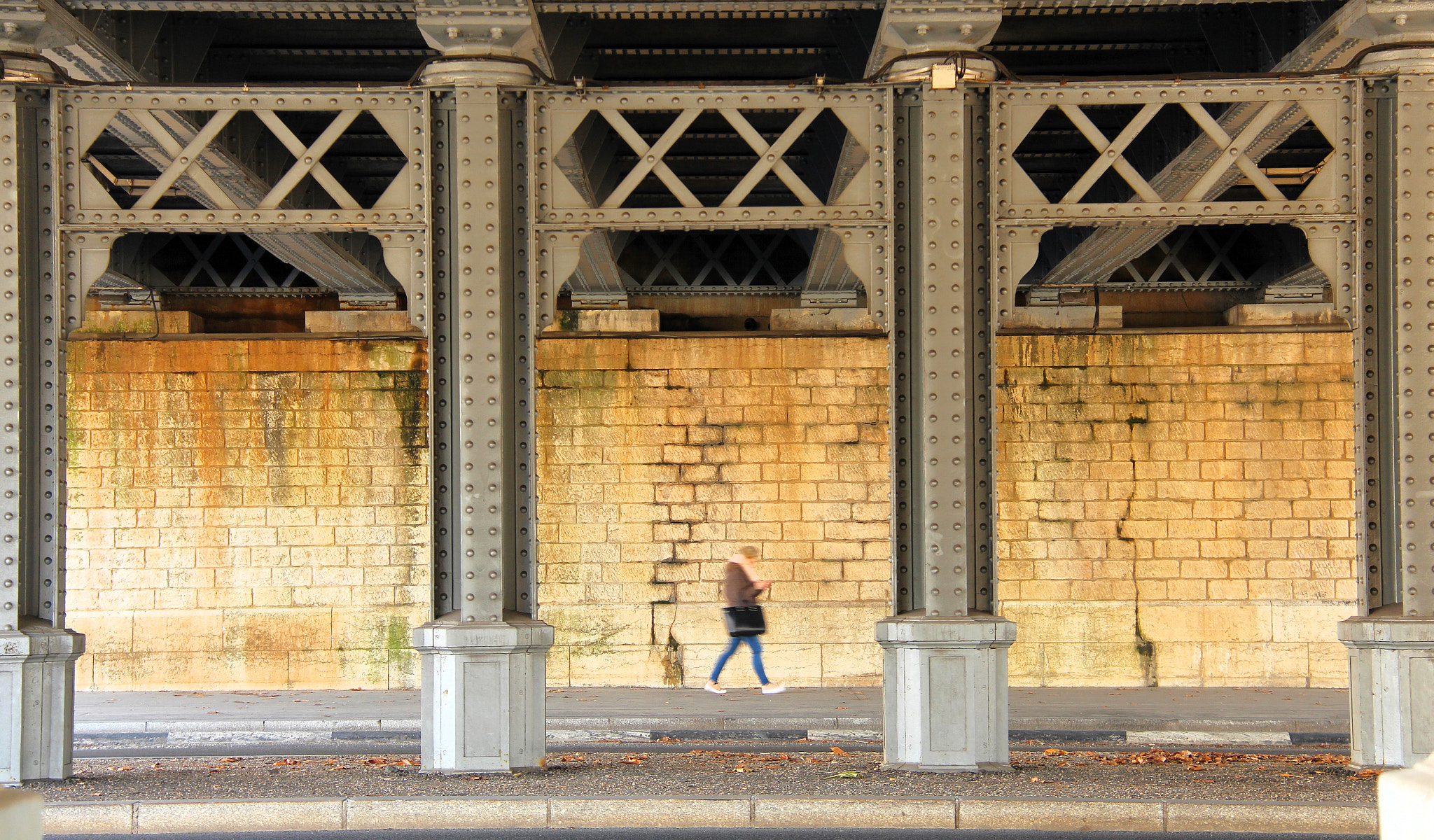 Solitary Figure Under Archway Portraying Urban Isolation and ...