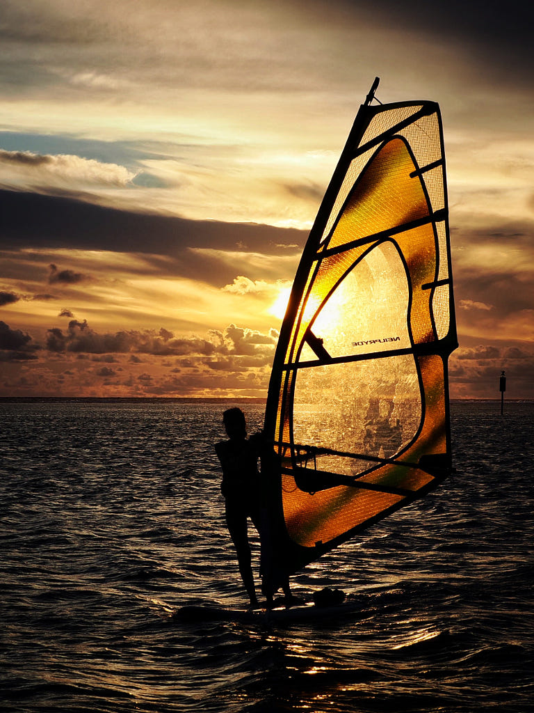 Windsurfer Glides at Sunset Depicting Freedom and Adventure | sports ...