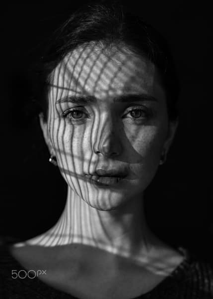 Woman's Face with Shadow Stripes Expressing Introspection and ...