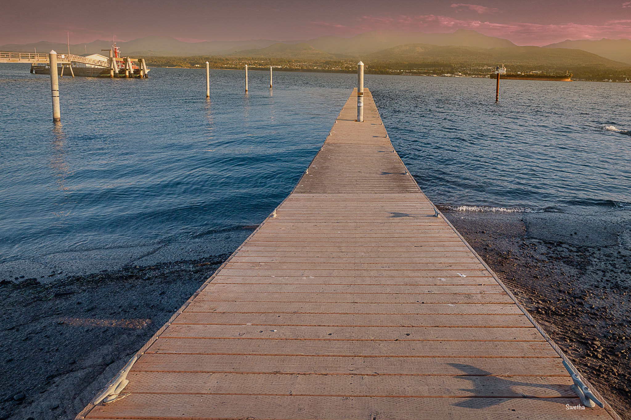 Long Wooden Pier Extending into Water Symbolizing Journey and Solitude ...