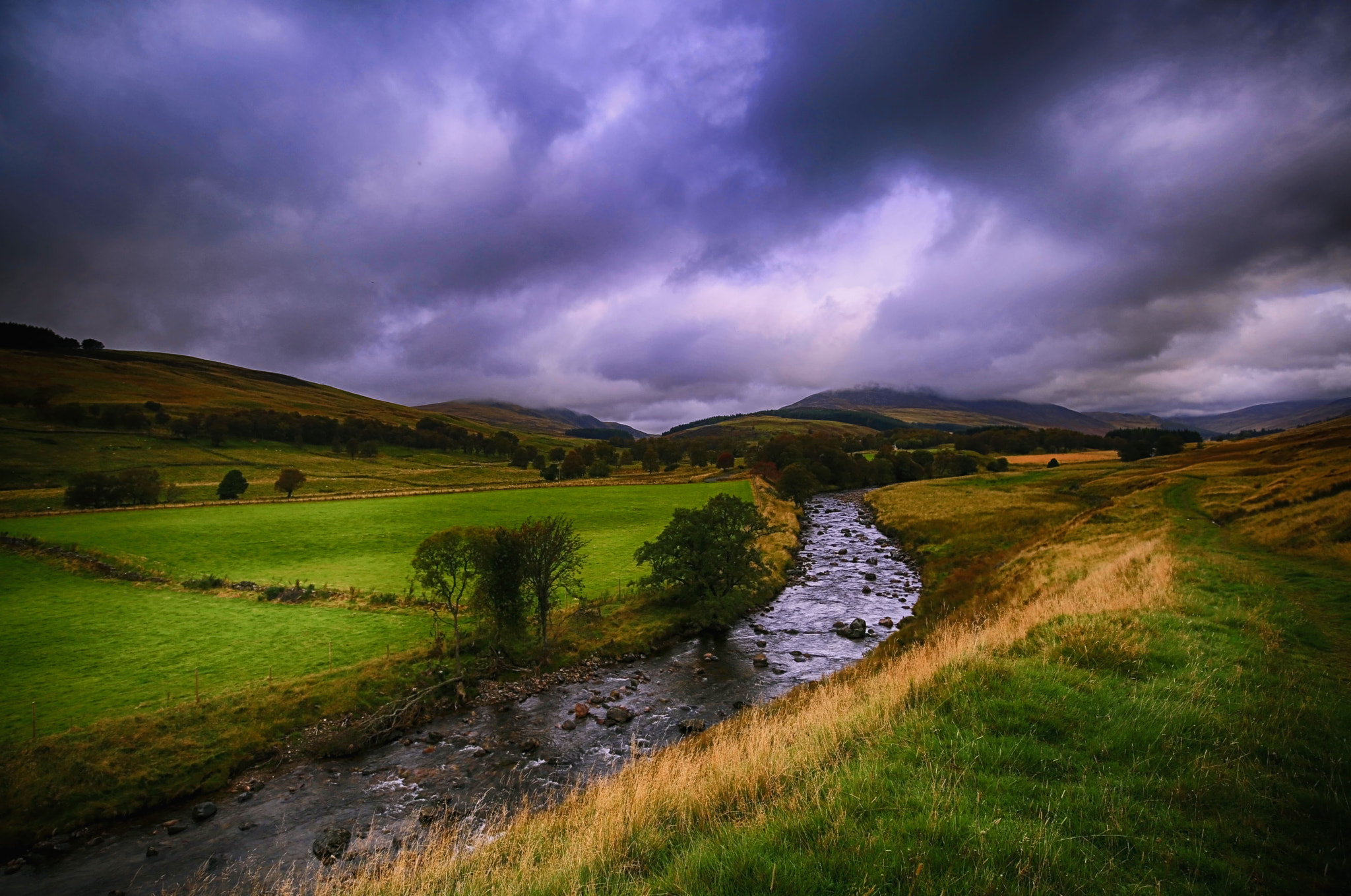 Dramatic Sky Looms Over Verdant Valley Evoking Nature's Power ...