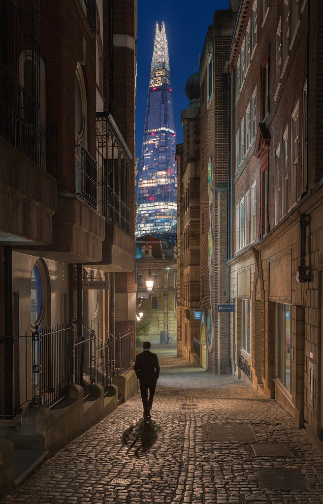 Lone Figure Walks Cobblestone Alley Towards Urban Future | city photo ...