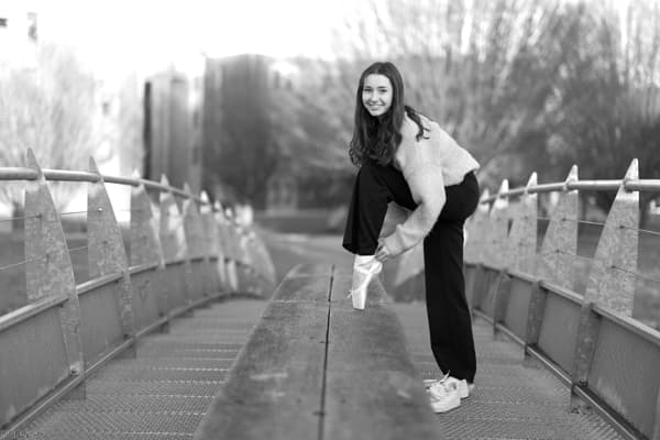 Young Woman Poses on Bridge Evoking Youth and Introspection | people ...