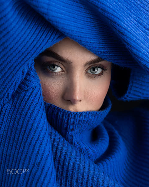 Mysterious Gaze Emerges from Blue Fabric Evoking Intrigue | people ...