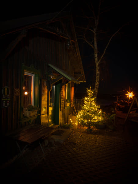 Cozy Cabin Radiates Warmth and Festive Spirit in Winter Night | events ...