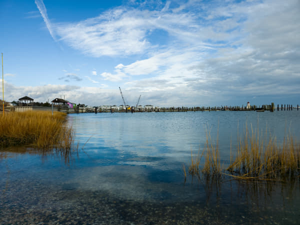 Reflective Waters Under Expansive Sky Evoking Peace and Openness ...