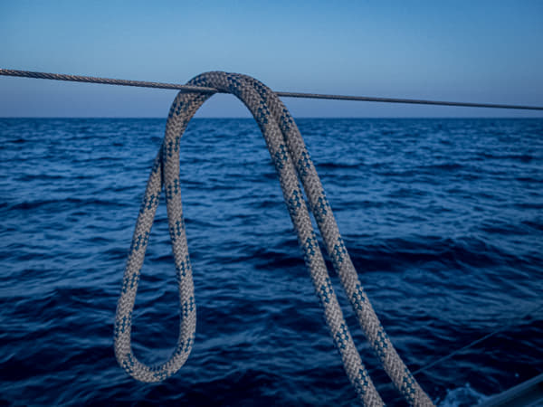 Nautical Rope on Blue Water Evoking Journey and Connection | landscape ...