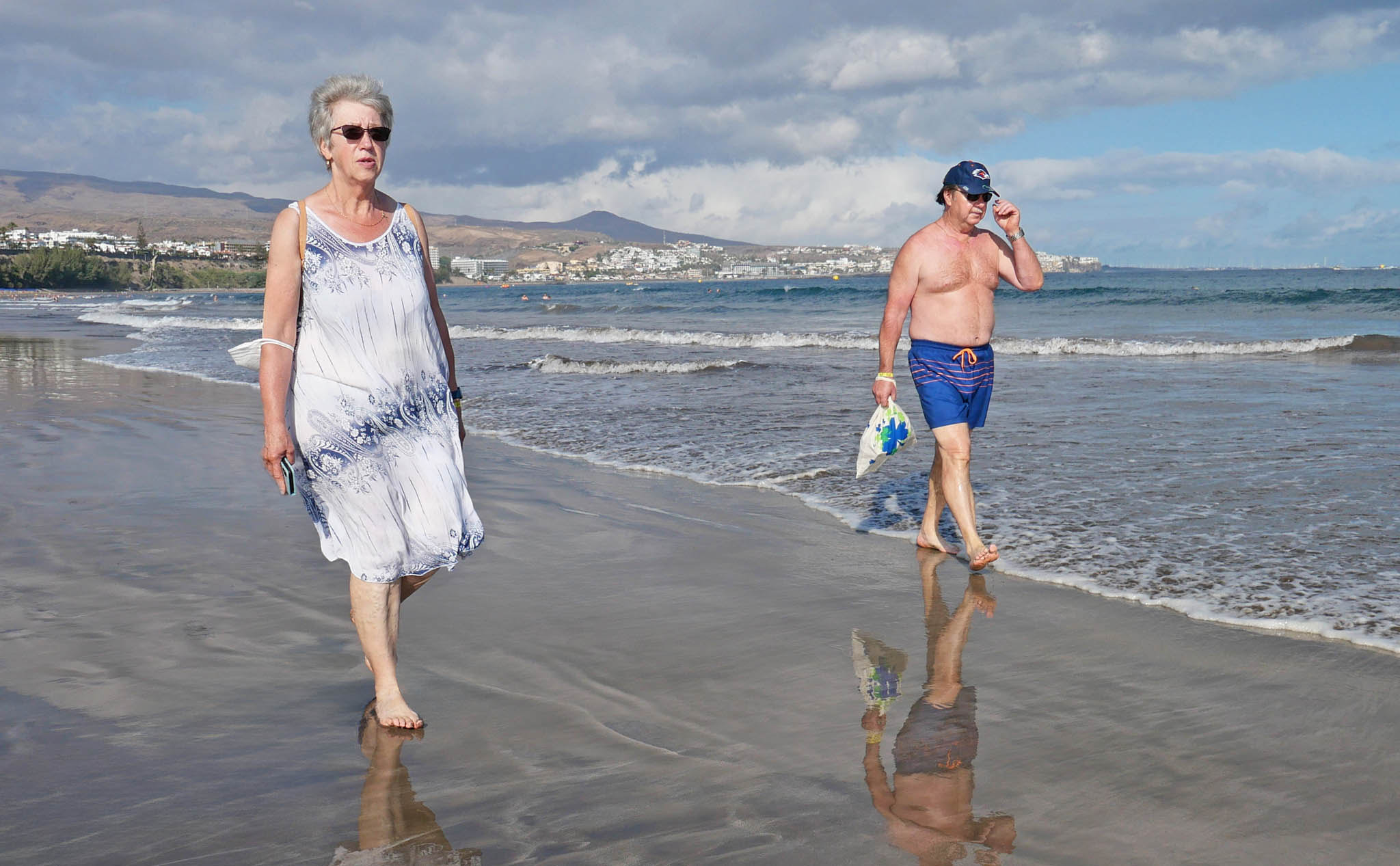 Couple Strolling on Beach Evoking Leisure and Togetherness | people ...