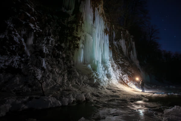 Explorer in Ice Cave Illuminating Discovery and Adventure | nature ...