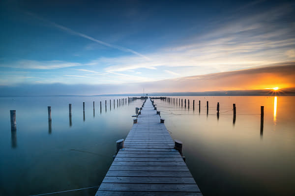 Pier at Sunset Evoking Serenity and Reflection | landscape photo by ...