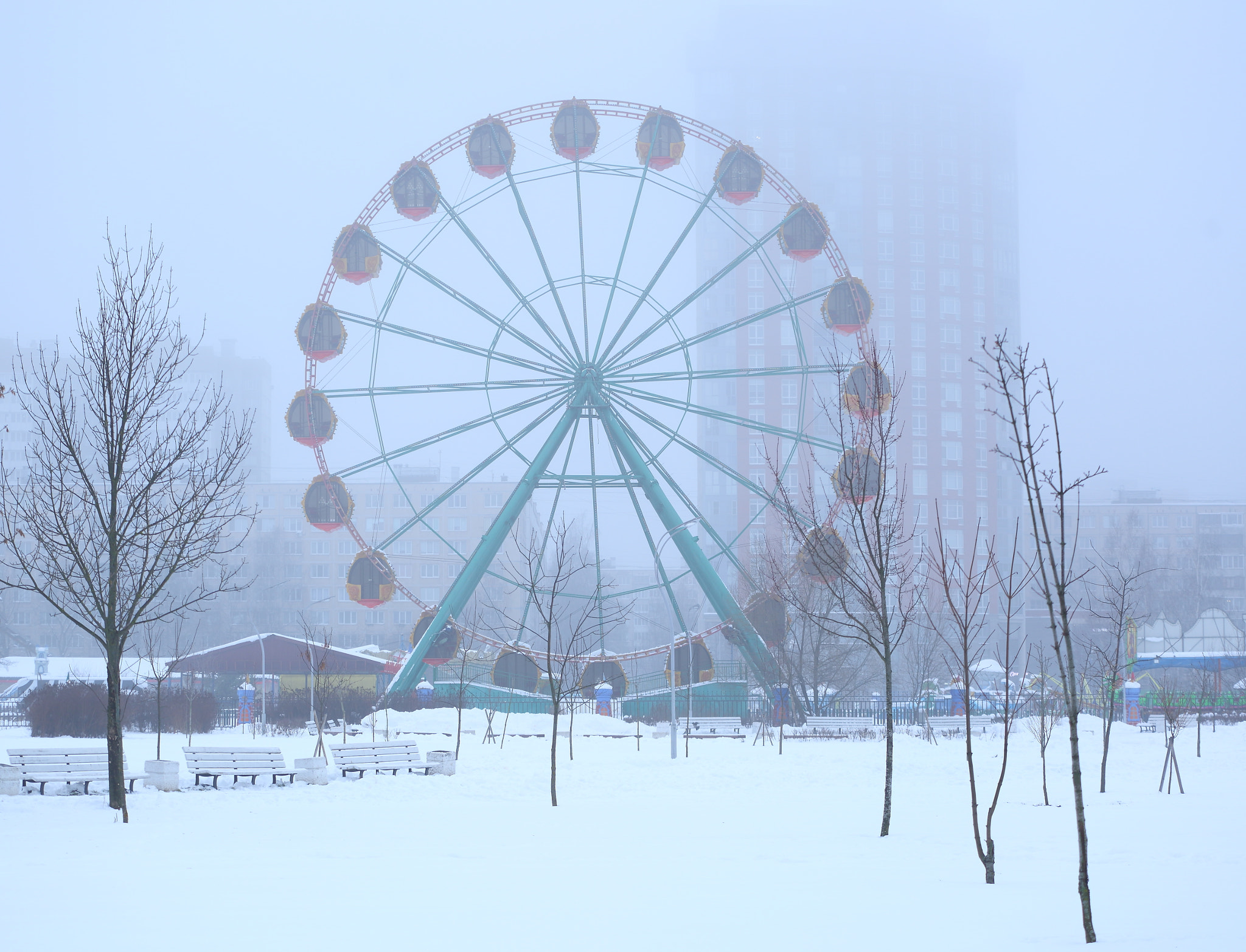 Ferris Wheel in Winter Fog Evoking Nostalgia and Solitude | city photo ...