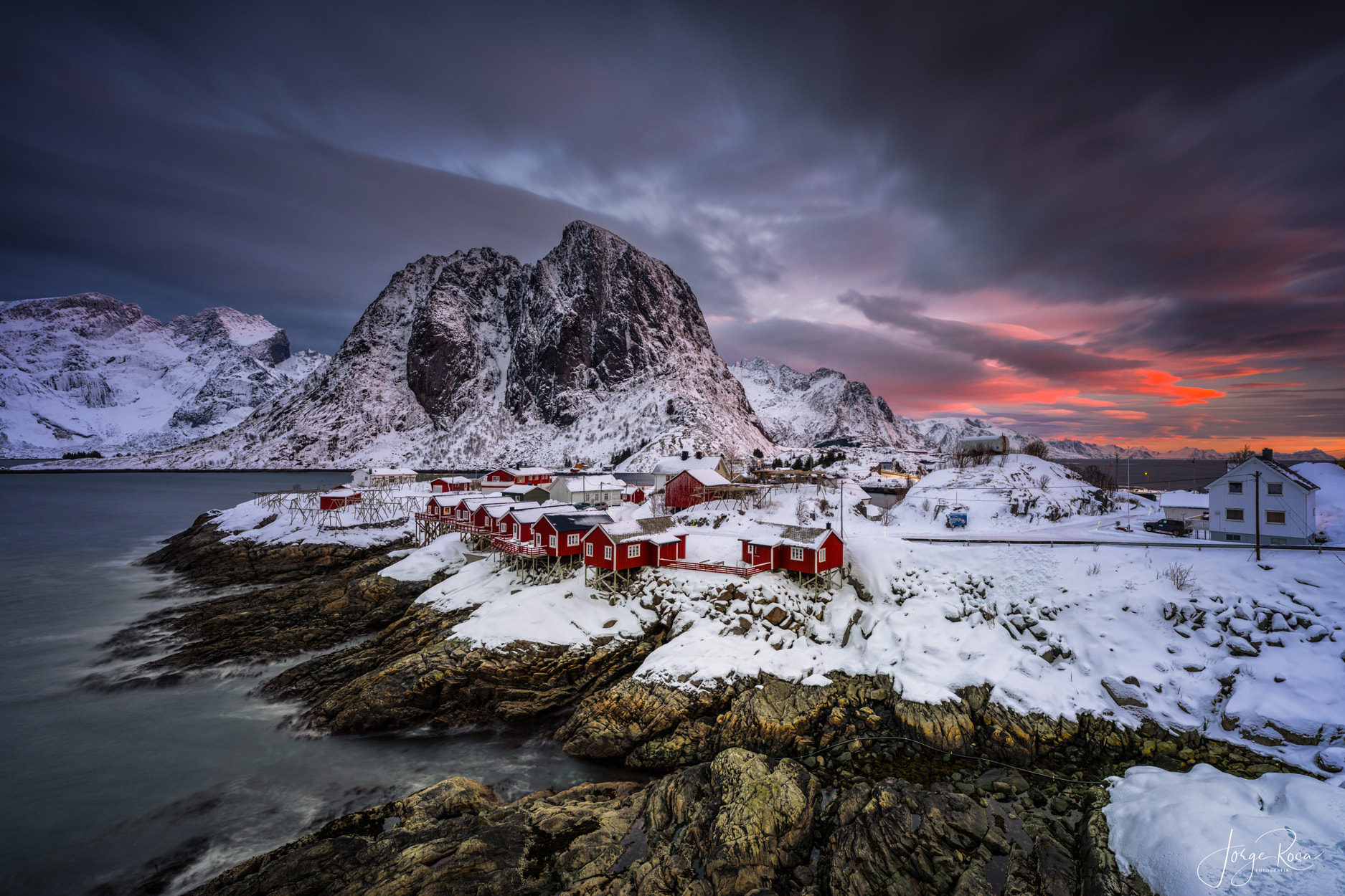 Coastal Village Under Dramatic Sky Radiating Resilience and Serenity ...