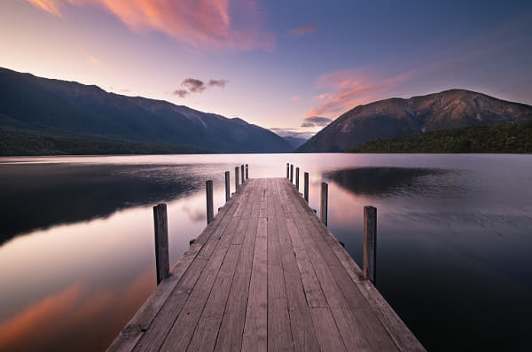 Wooden Pier Extending into Calm Lake at Dawn Evoking Tranquil Journey ...