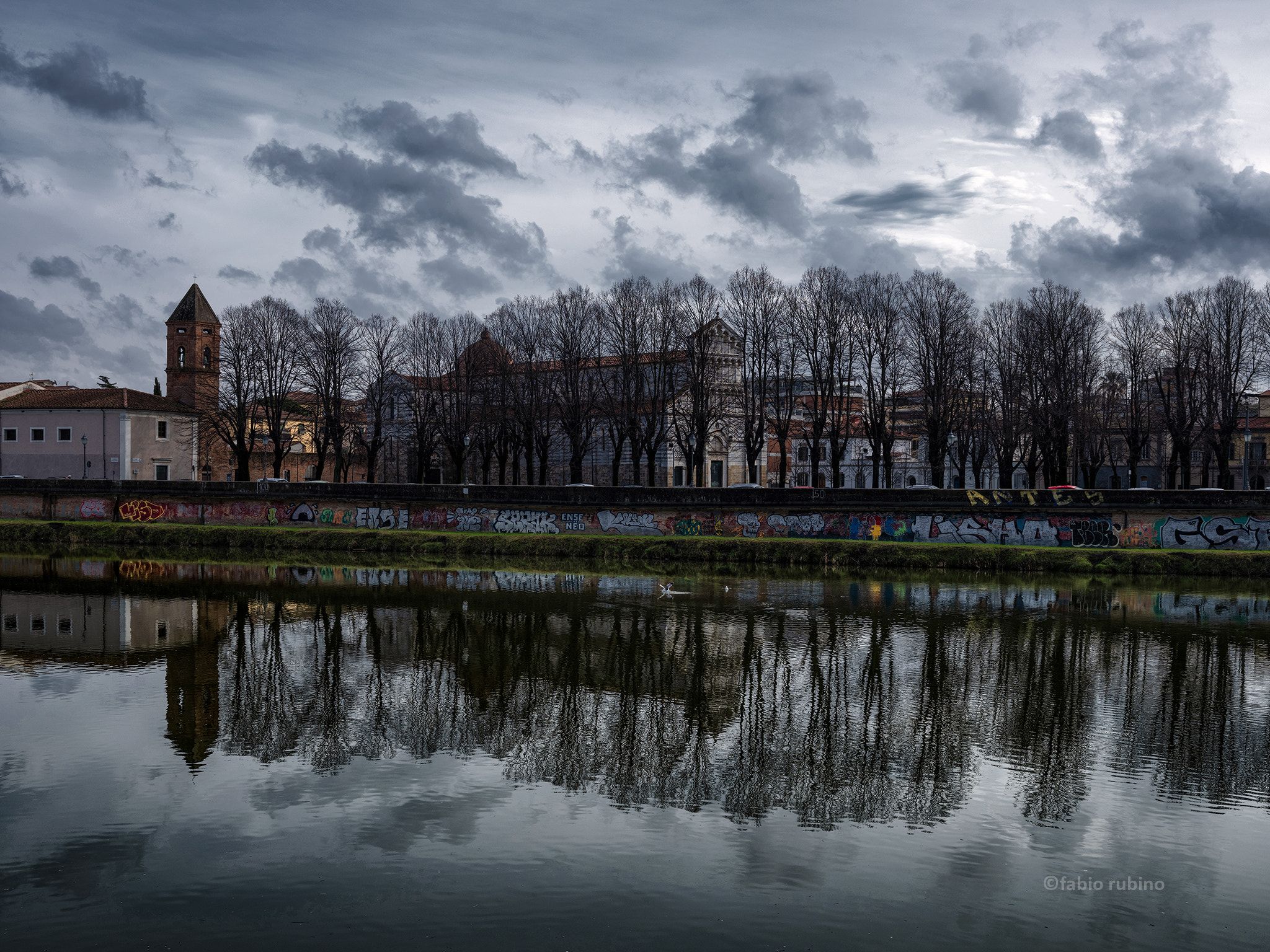 Reflective Waters Under Stormy Sky Evoking Moodiness and Contemplation ...