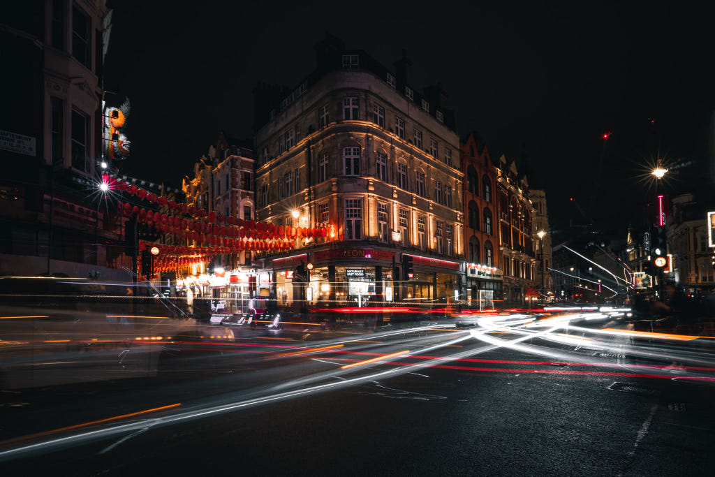 Urban Vendor Illuminates Rainy Night with Warmth and Sustenance | city ...