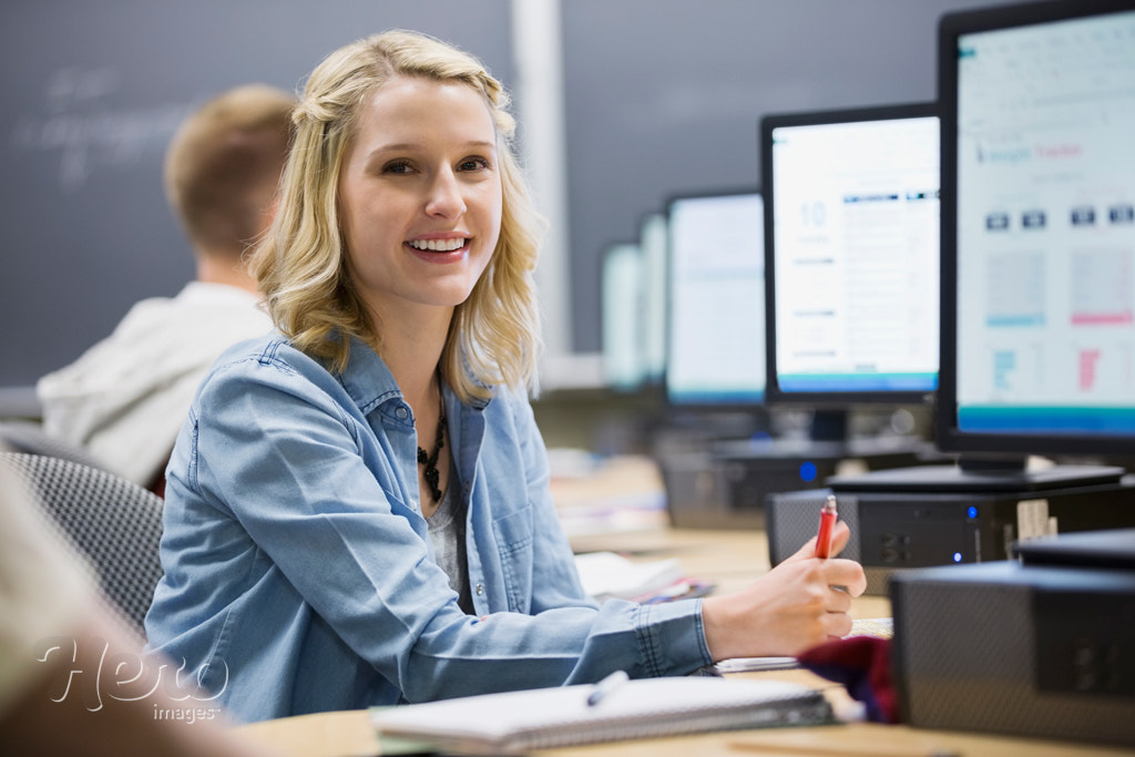 Portrait smiling college student in computer lab classroom by Hero ...