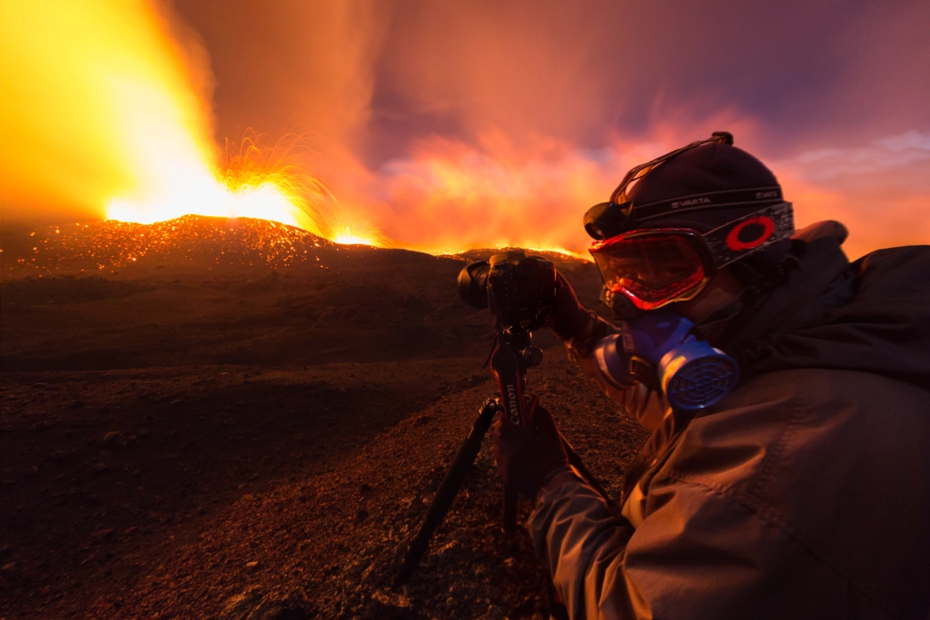 Photographer during volcanic eruption by LR Photographies / 500px