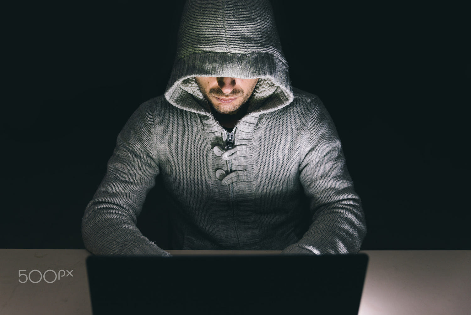 Hacker at work on his computer by Cristian Negroni / 500px