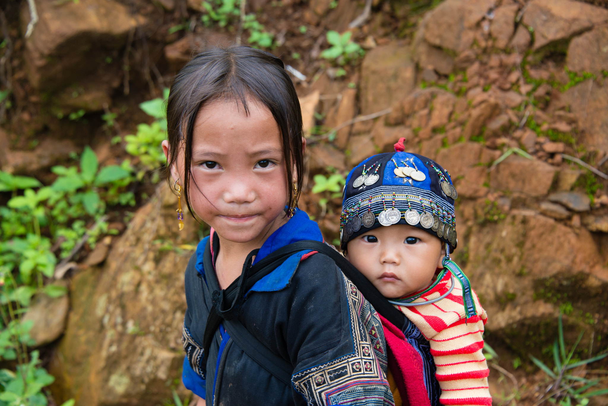 Hmong girl carrying a baby by Nir Tal / 500px Hmong girl carrying a baby by Nir Tal / 500px