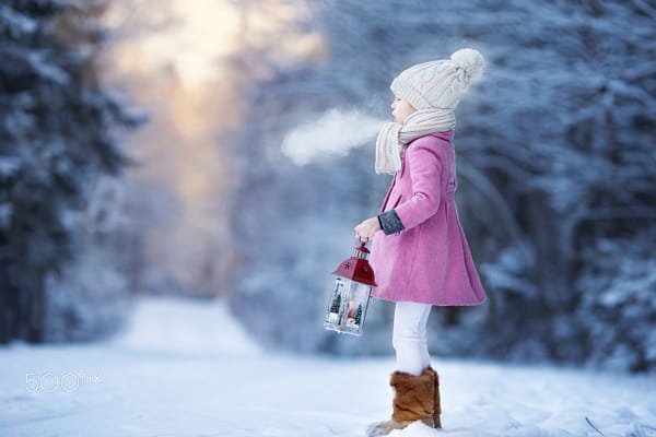 Adorable little girl with flashlight in frozen winter on Christmas ...