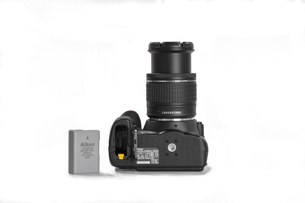 Nikon D3300 Base and battery battery door open by Nigel Flory / 500px
