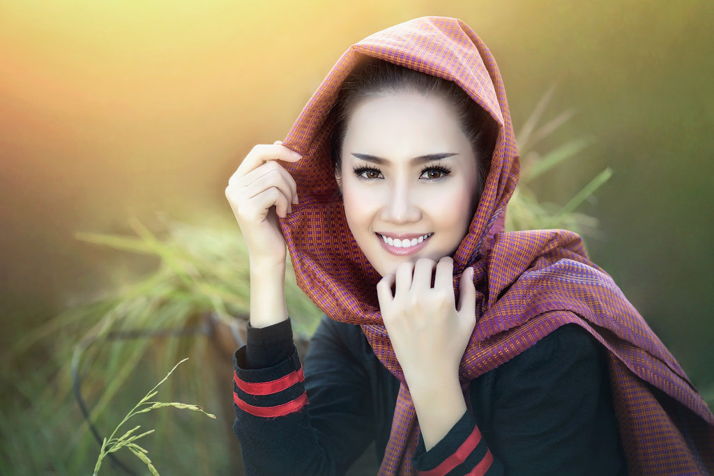Asian woman smiling at the farm in the countryside by Pitakchatr Thepracha / 500px