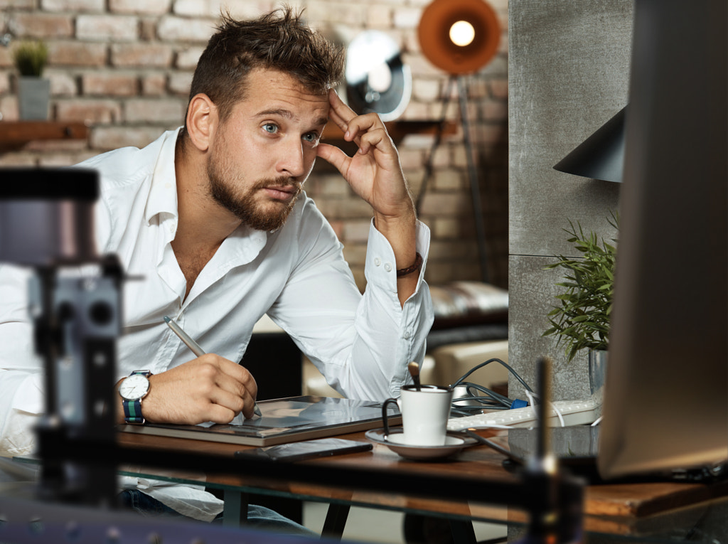 Inventor working on design at office desk by h20 photostudio / 500px