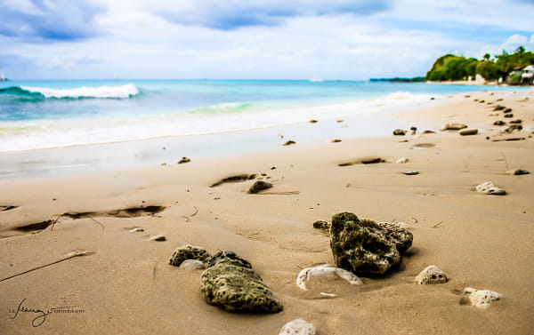 Footsteps on rock beach by Elena K. Manzo / 500px