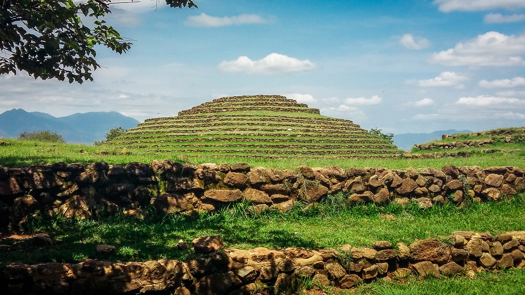 Ancient Circular Pyramid in Lush Green Landscape | city photo by ...