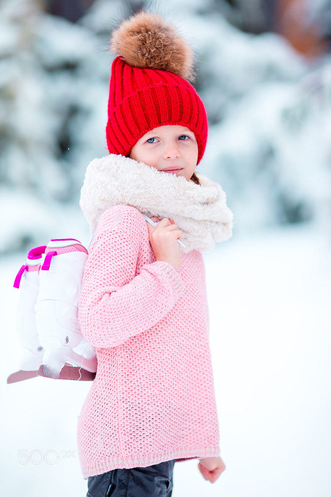 Cute little kid girl is going skate outdoors. by Dmitrii Travnikov | 500px