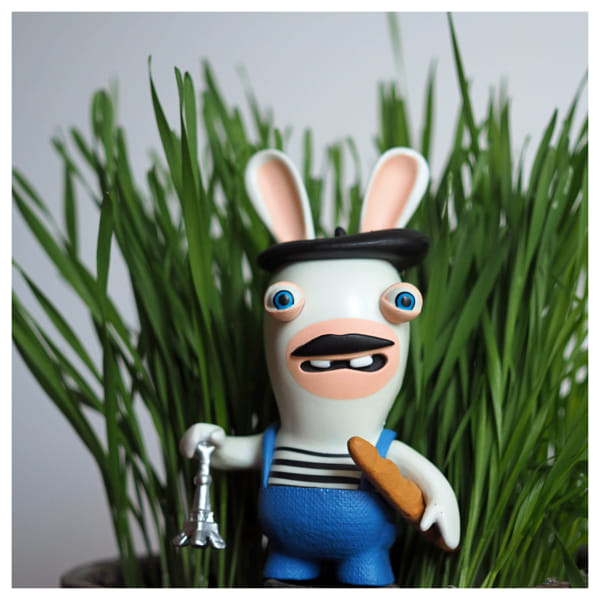Rabbids Toy with Eiffel Tower in Green Grass | still life photo by ...