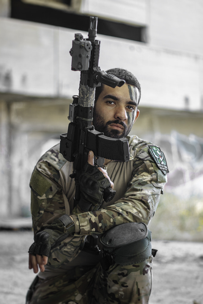 Soldier in Camouflage Holding Rifle | people photo by Illy Singer | 500px